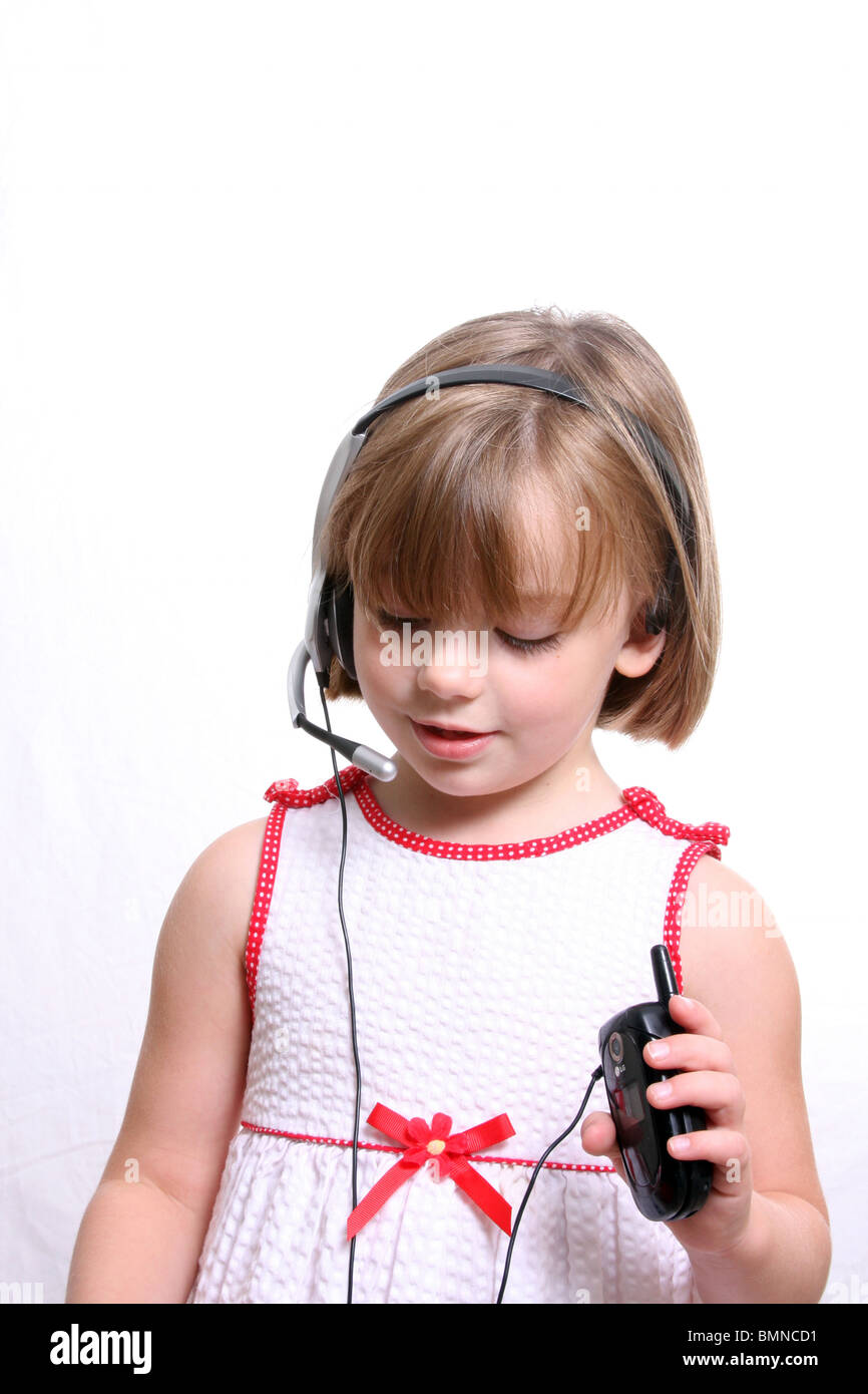 A young business girl talking on a phone conversation child kid Stock ...