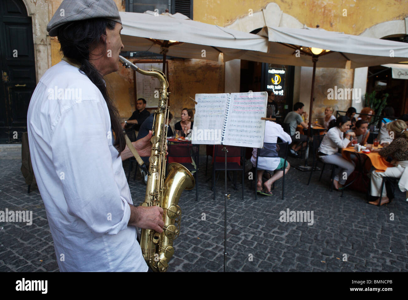 Busker buskers busking in the street streets hi-res stock photography ...