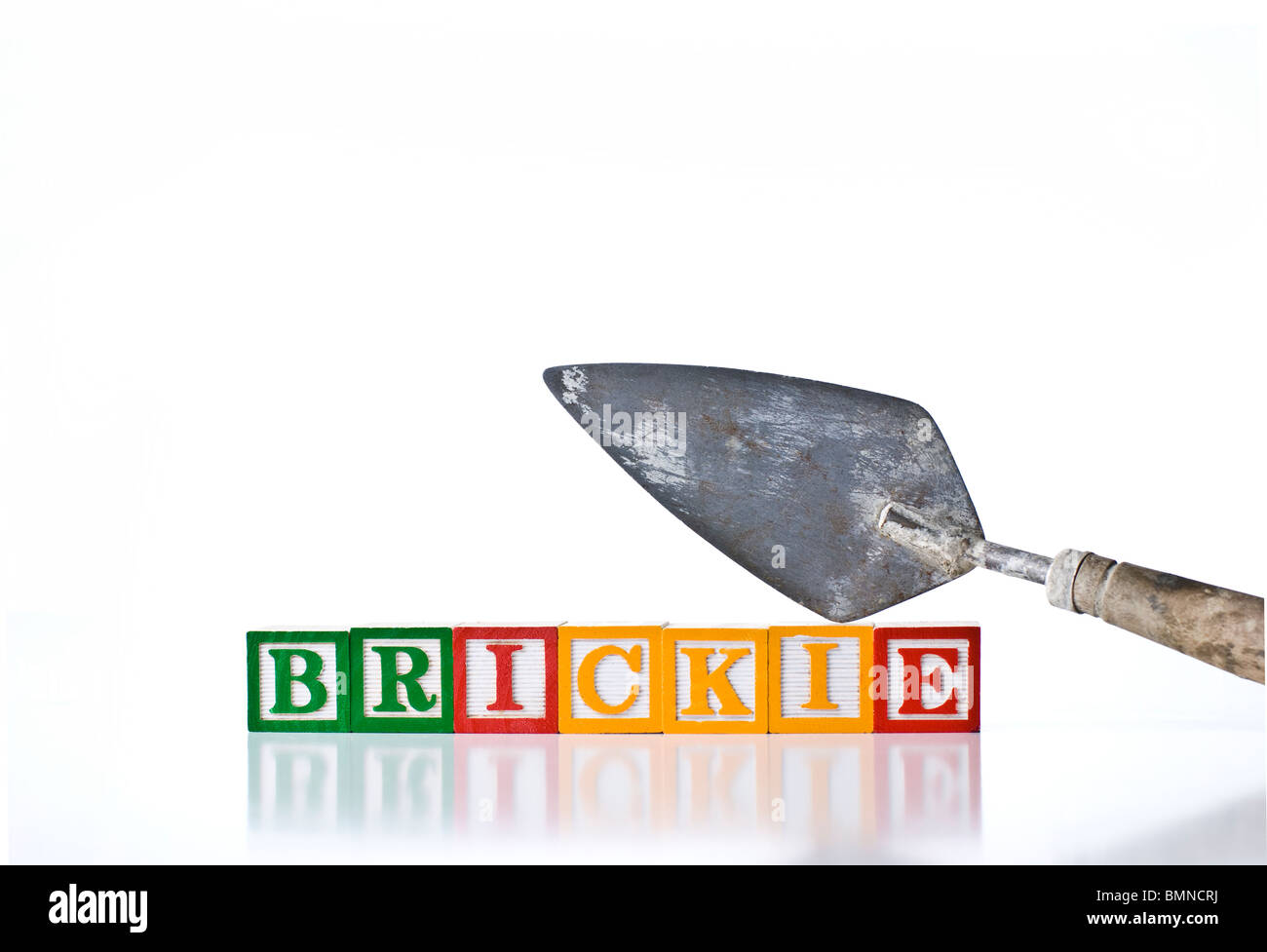 Colorful children's blocks spelling BRICKIE with a mason's trowel Stock ...