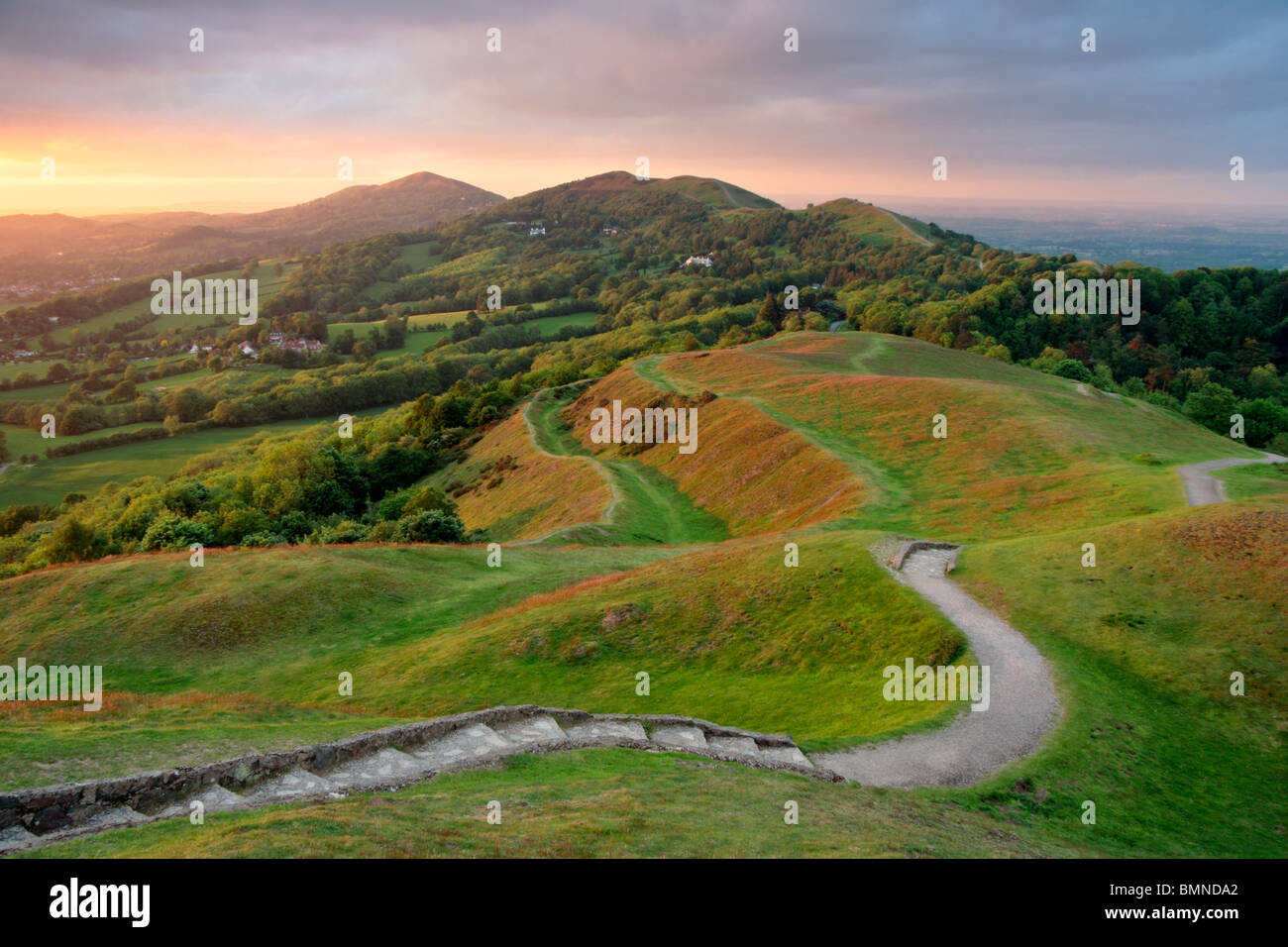 View of the Malvern Hills at sunset as seen from the iron age hill fort ...
