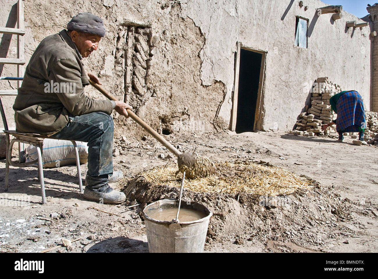 Old people working on their house, Khiva, Uzbekistan, Asia Stock Photo ...