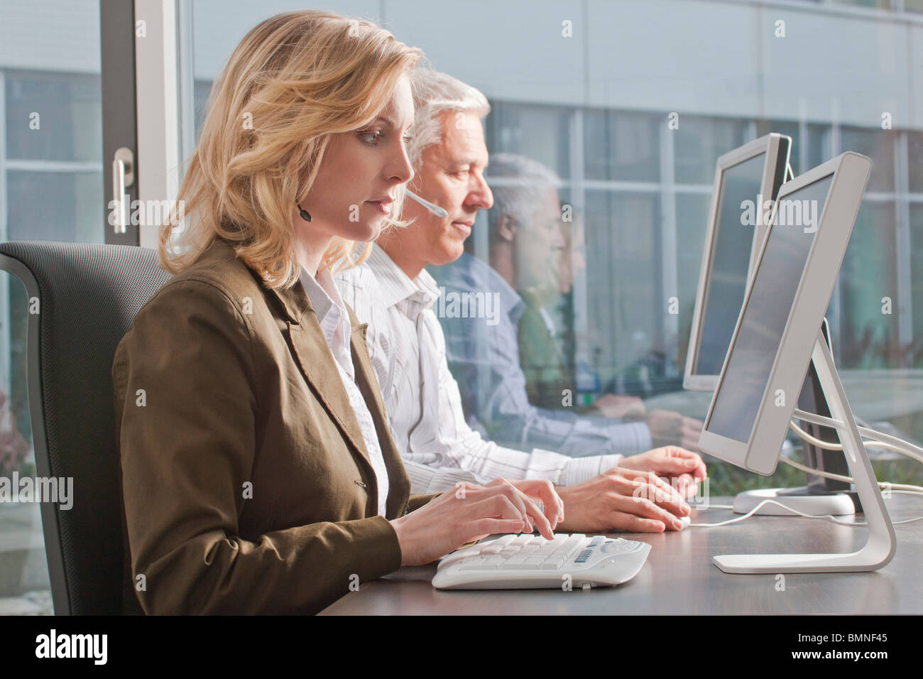 Two people working in a call center Stock Photo - Alamy