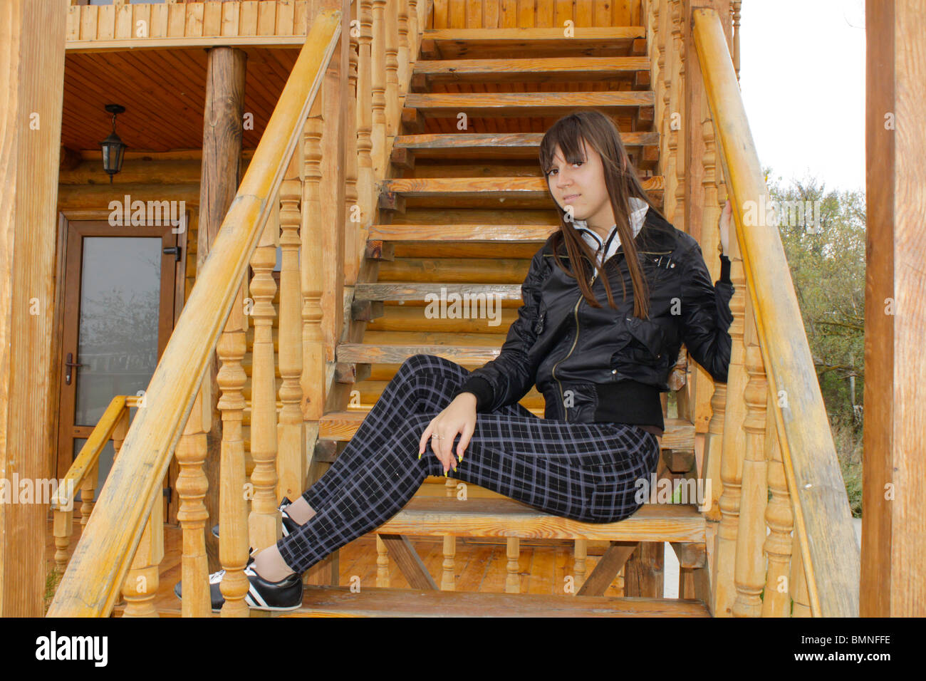 Closeup of the girl at the staircase Stock Photo - Alamy