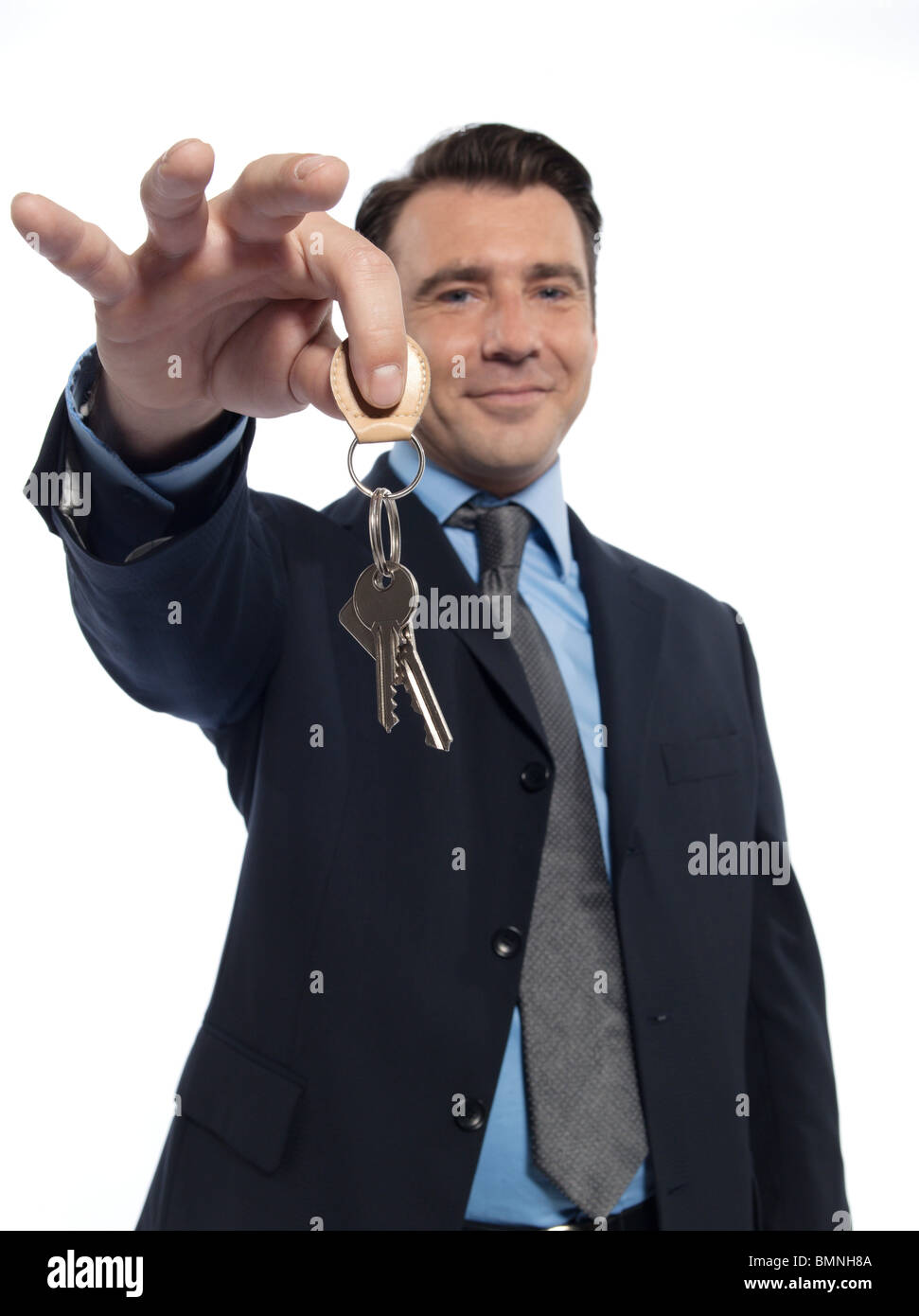 Man businessman handing keys studio isolated white background Stock ...