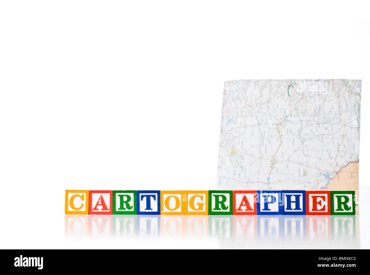 Colorful children's blocks spelling CARTOGRAPHER with a map Stock Photo ...