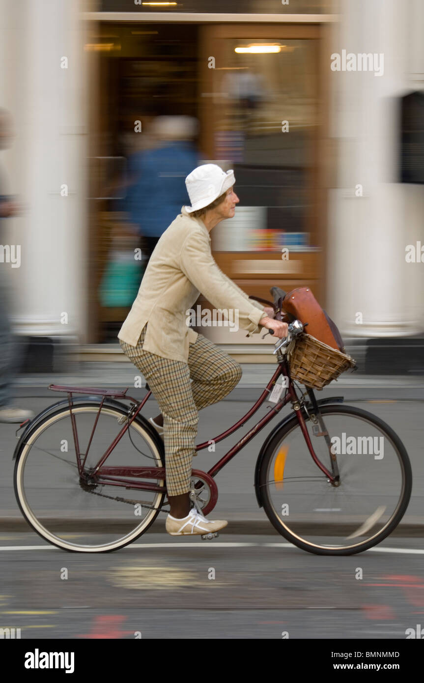 Woman cycling commuting england hi-res stock photography and images - Alamy