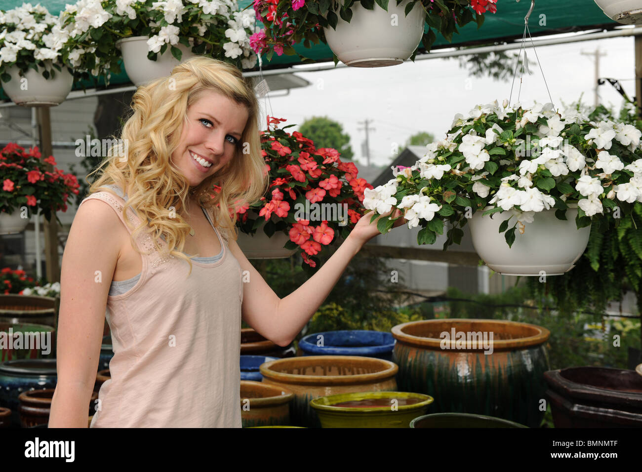 Portrait of beautiful young woman gardening Stock Photo - Alamy