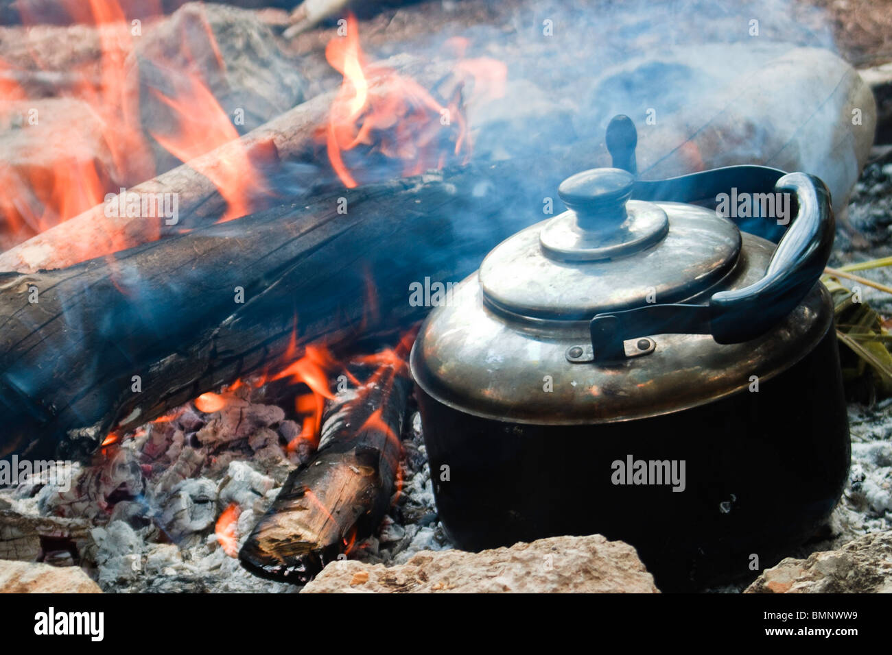 Kettle on a camp-fire Stock Photo - Alamy