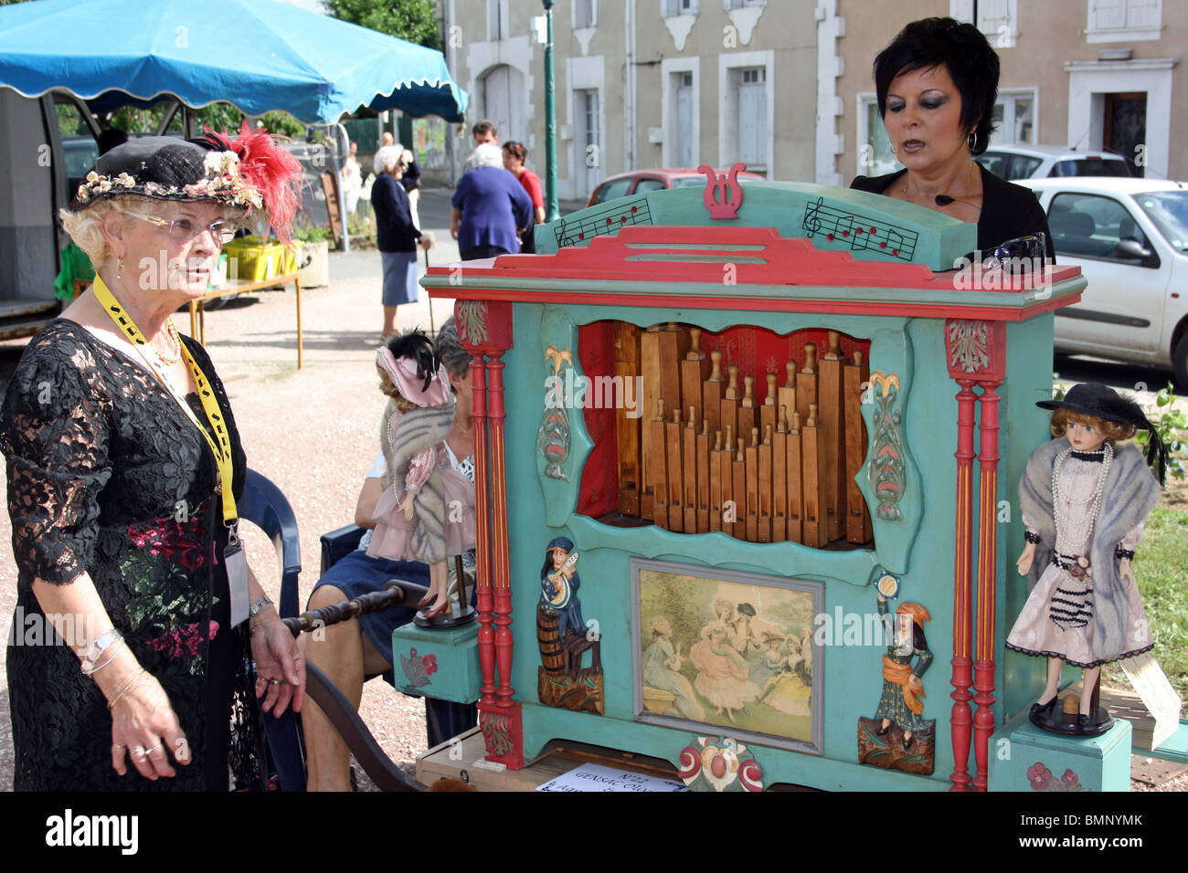 Naively painted barrel organ in use Stock Photo - Alamy
