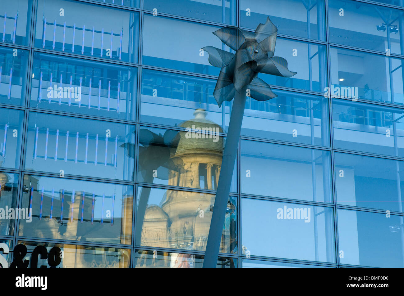 The Triangle building and windmill reflected in the windows of the ...