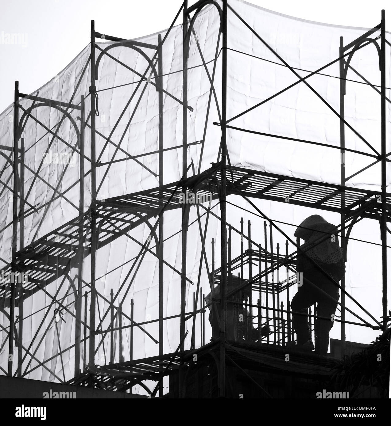 Steel pipes, ladders and safety nets are used as scaffolds Stock Photo ...