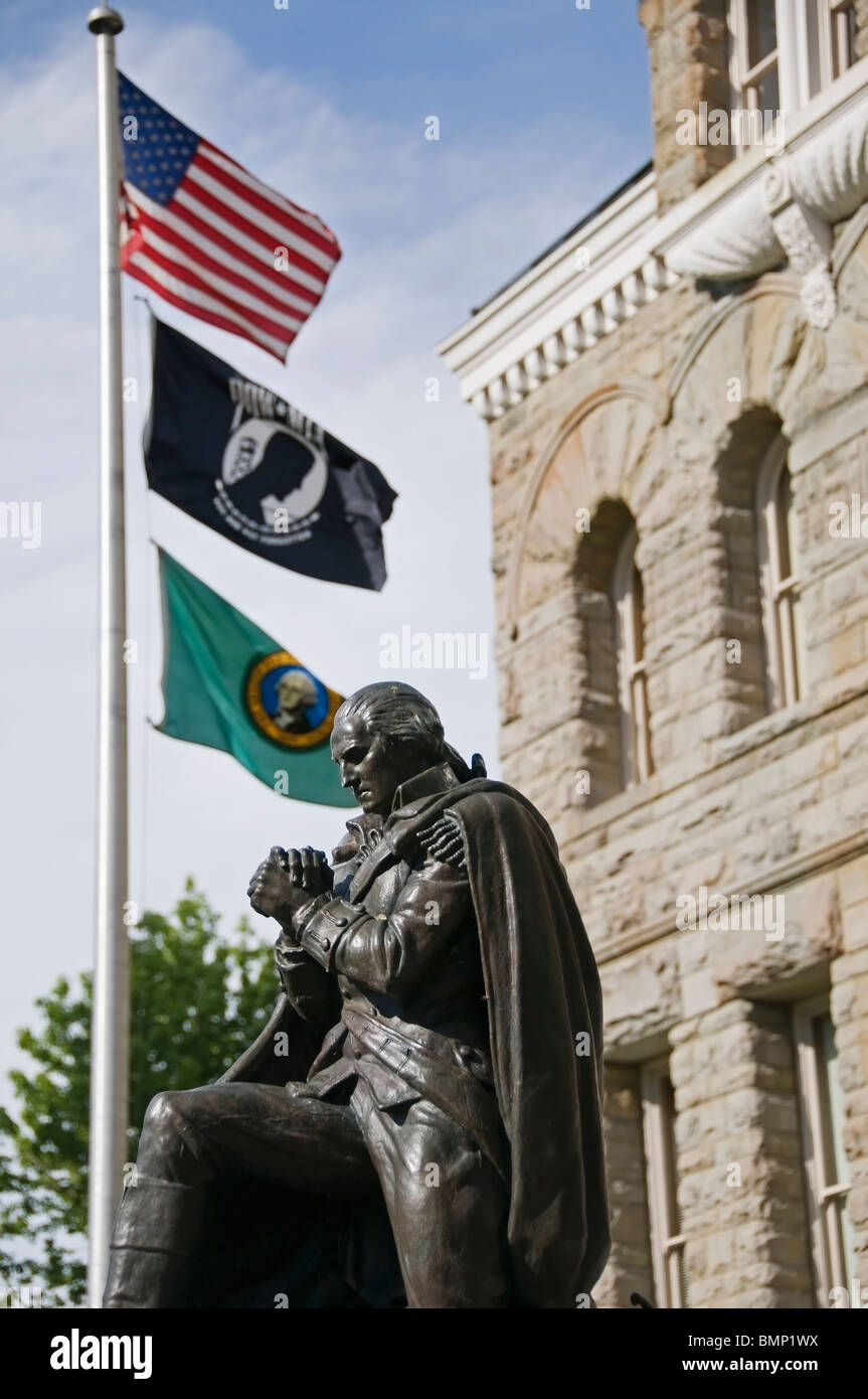 Side view of the George Washington statue in front of the old capitol ...