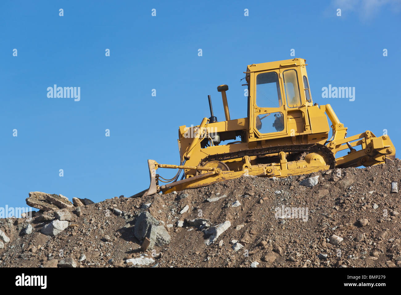 A Bulldozer Parked Amongst Rubble To Be Cleared Stock Photo - Alamy