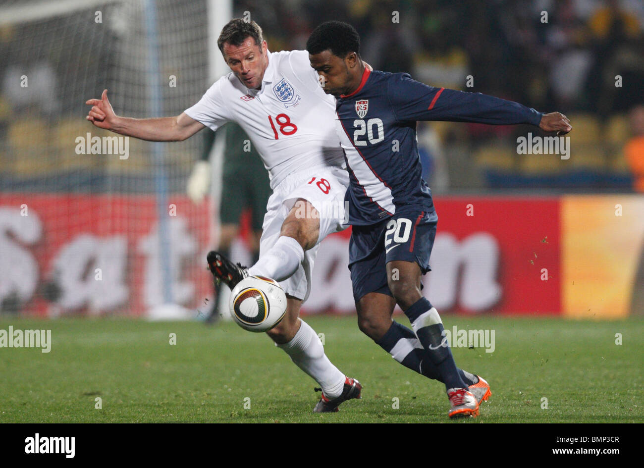 Jamie Carragher of England (18) and Robbie Findley of the United States ...