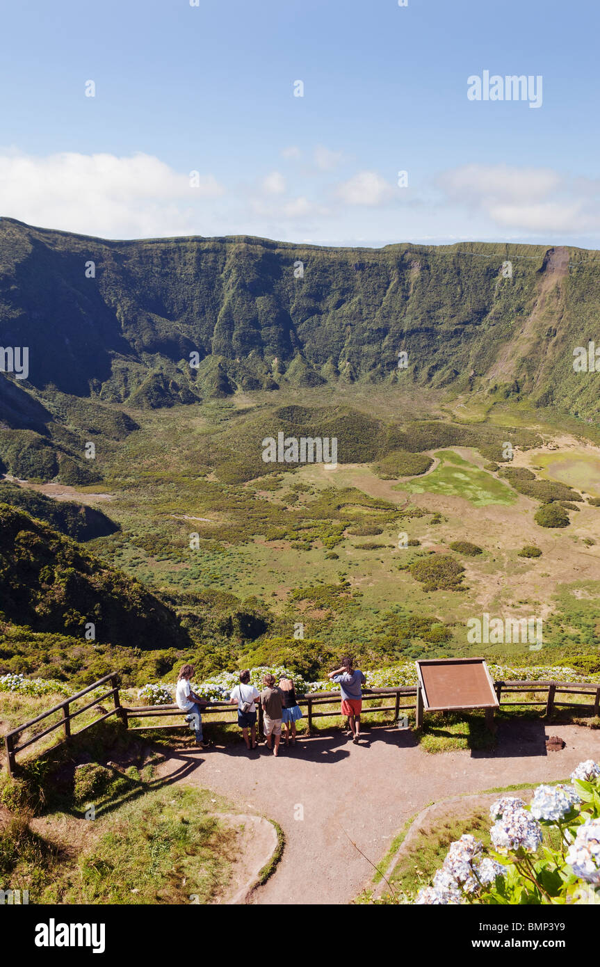 Tourists admiring Caldeira extinct volcano in Faial island, Azores ...