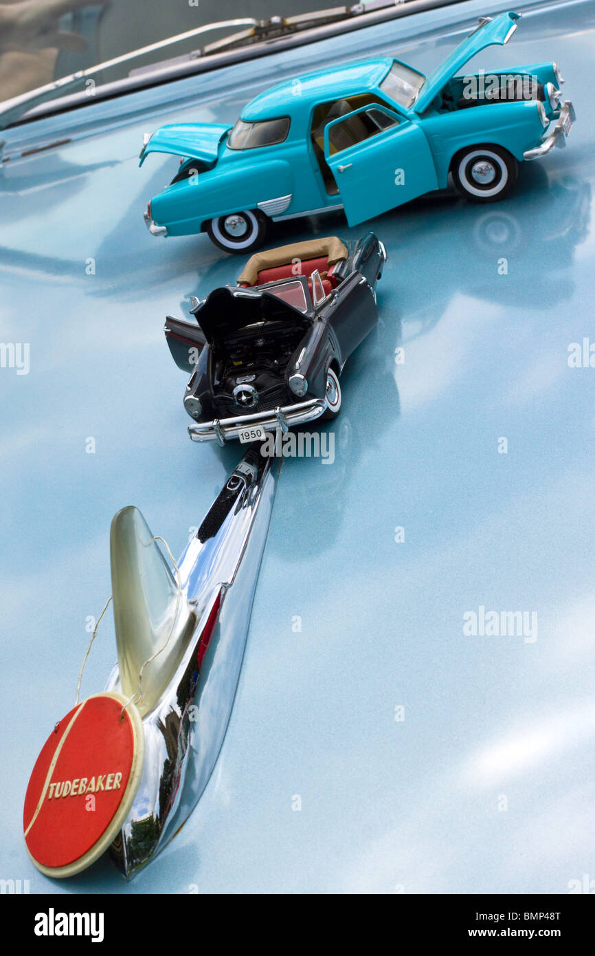 Die cast Children's Model toy cars on Bonnet of a Vintage car Stock ...