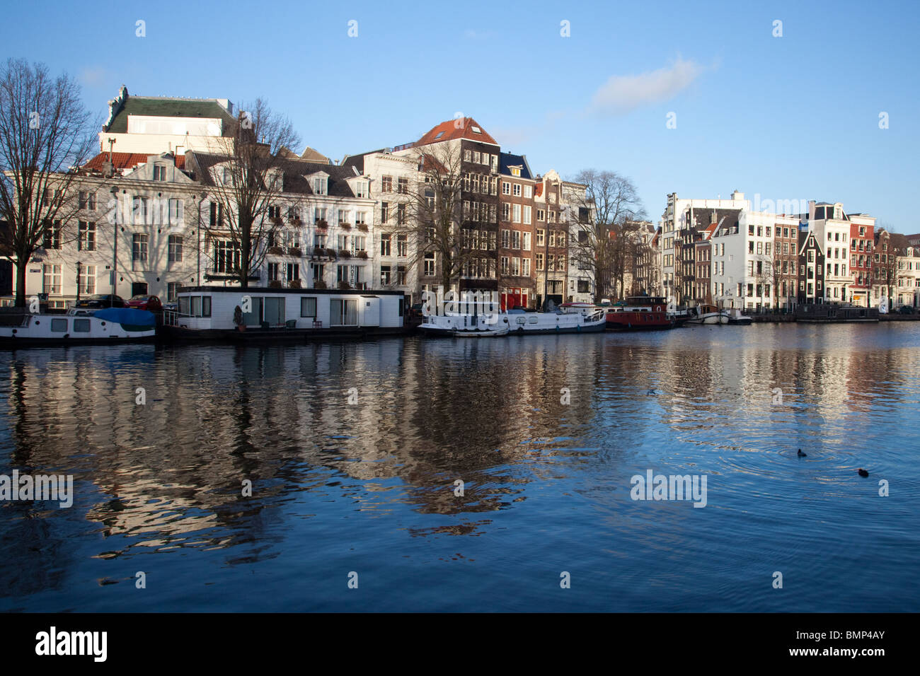 Buildings along the Amstel river in the city of Amsterdam Stock Photo ...