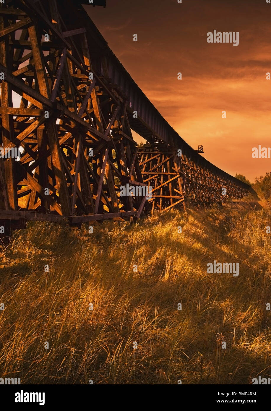 Alberta, Canada; A Train Trestle In A Sunset Stock Photo - Alamy