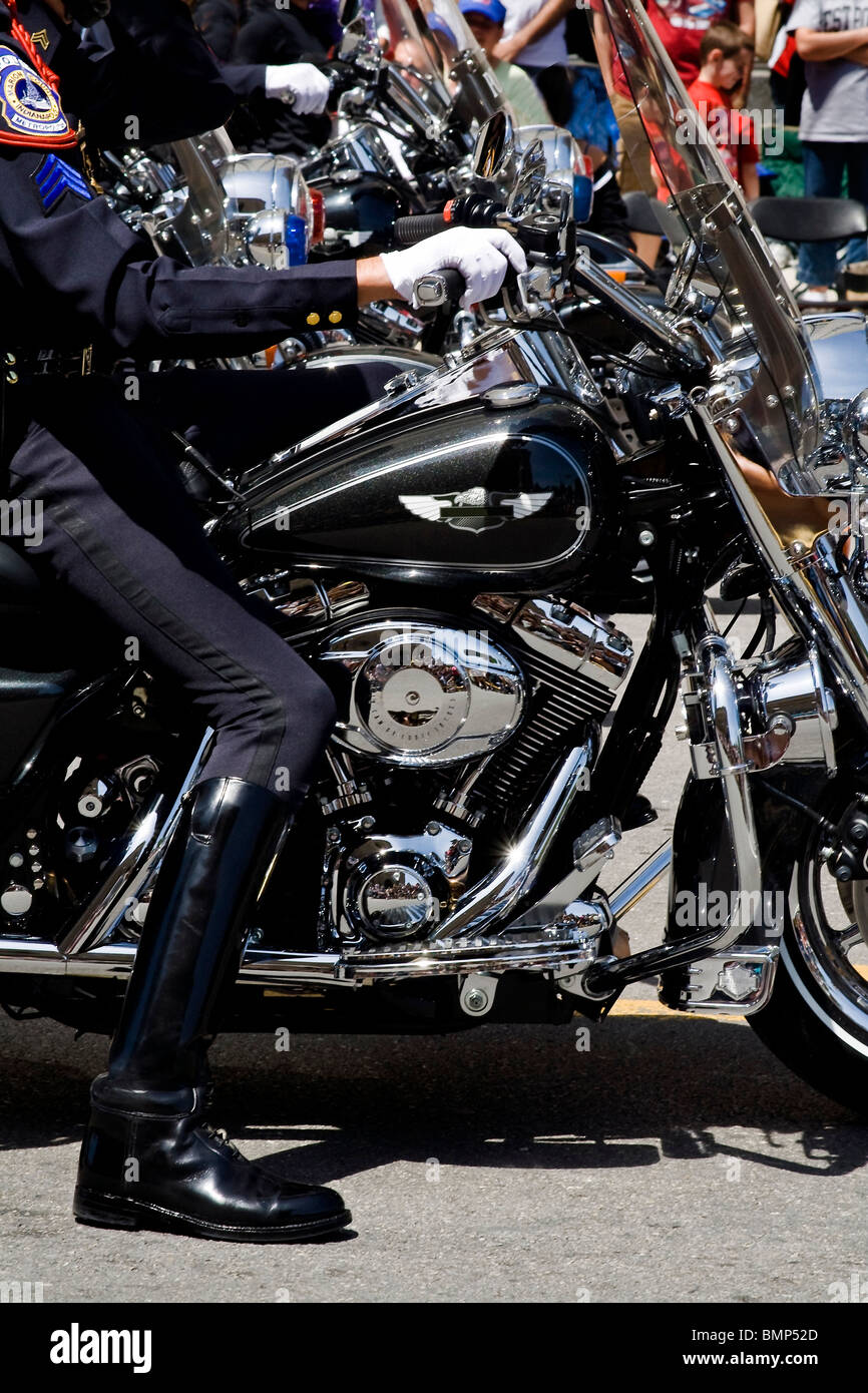 Close up of a police officer’s legs on a motorcycle Stock Photo - Alamy