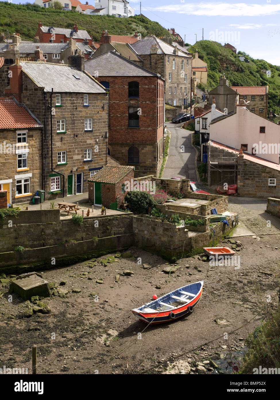A steep side street in Staithes North Yorkshire leading down to Roxby ...