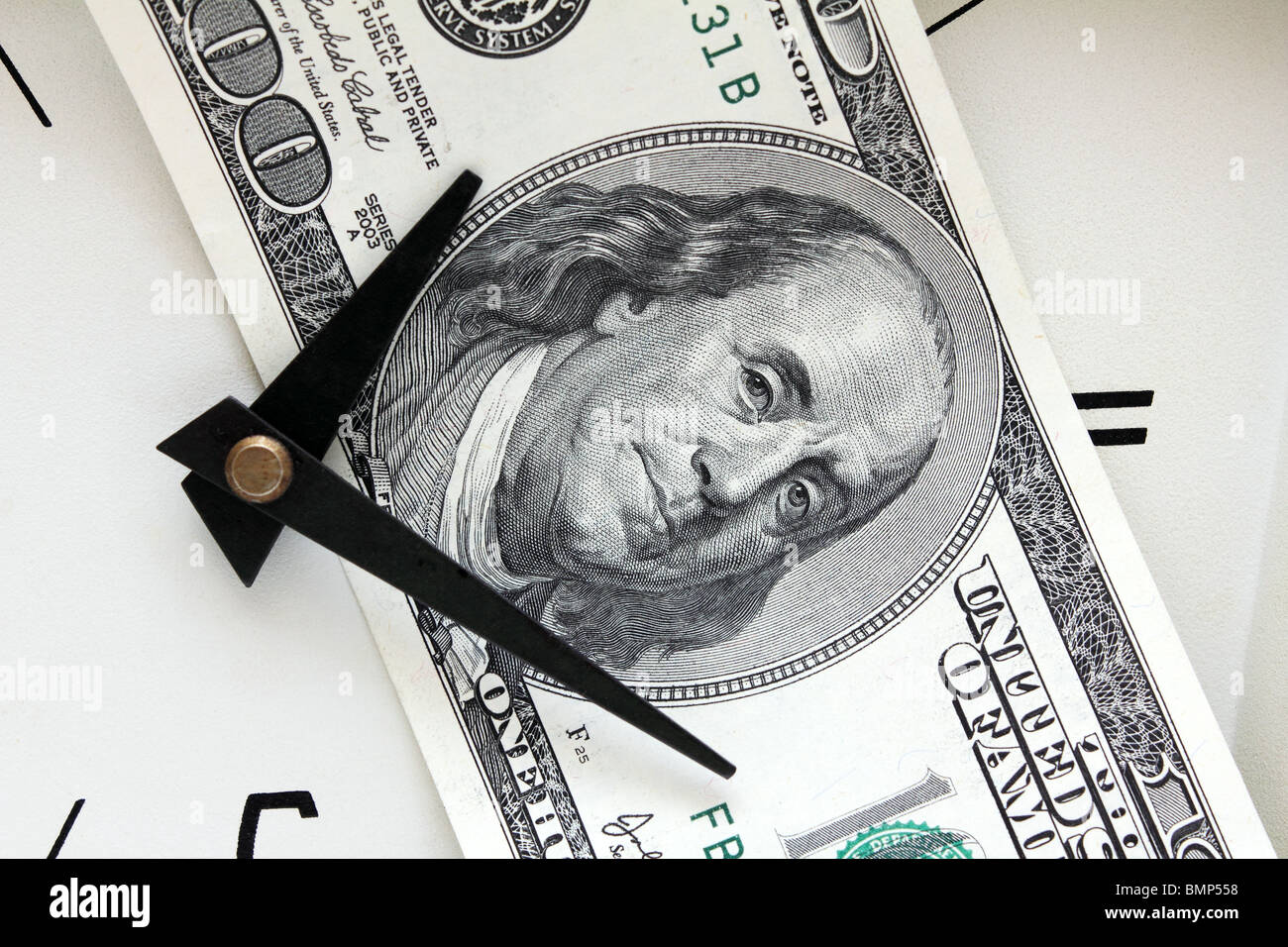 time is money concept with hundred dollars Stock Photo - Alamy