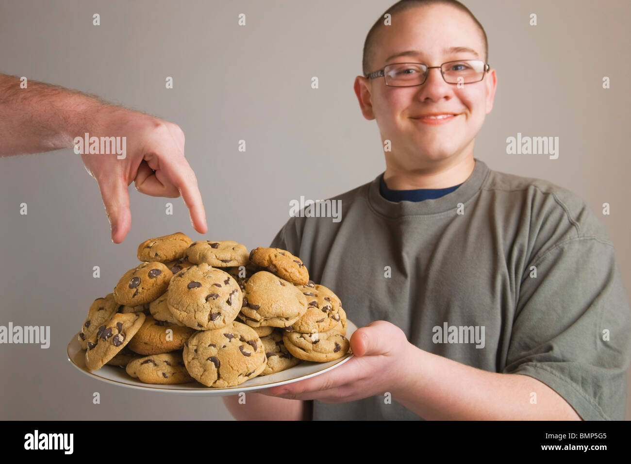 Kid stealing cookie hi-res stock photography and images - Alamy