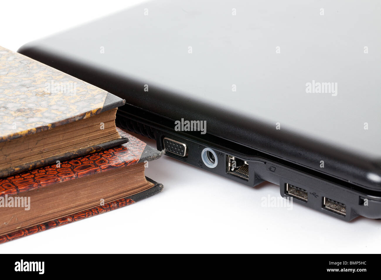 old books and laptop on white background Stock Photo - Alamy