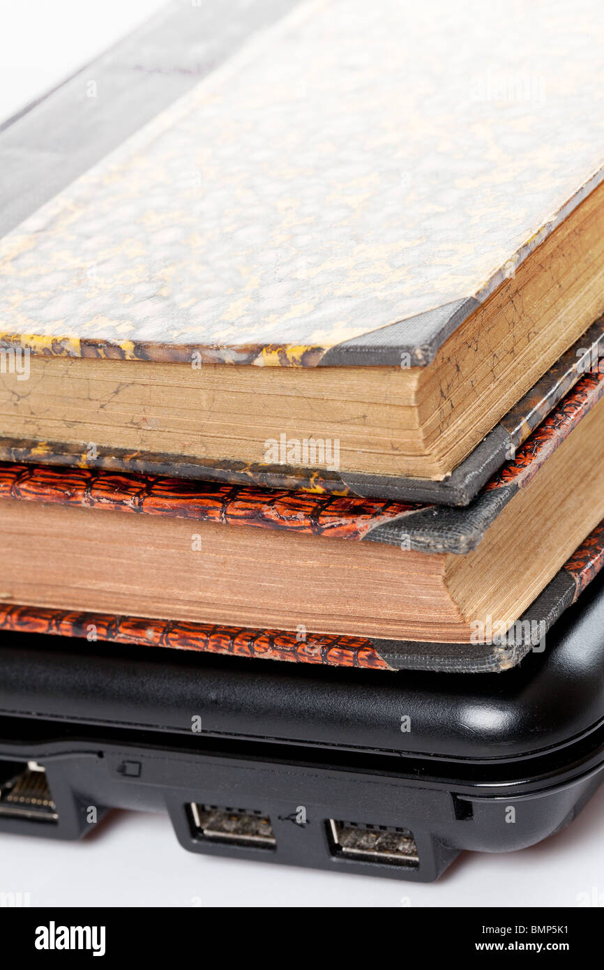 old books and laptop on white background Stock Photo - Alamy