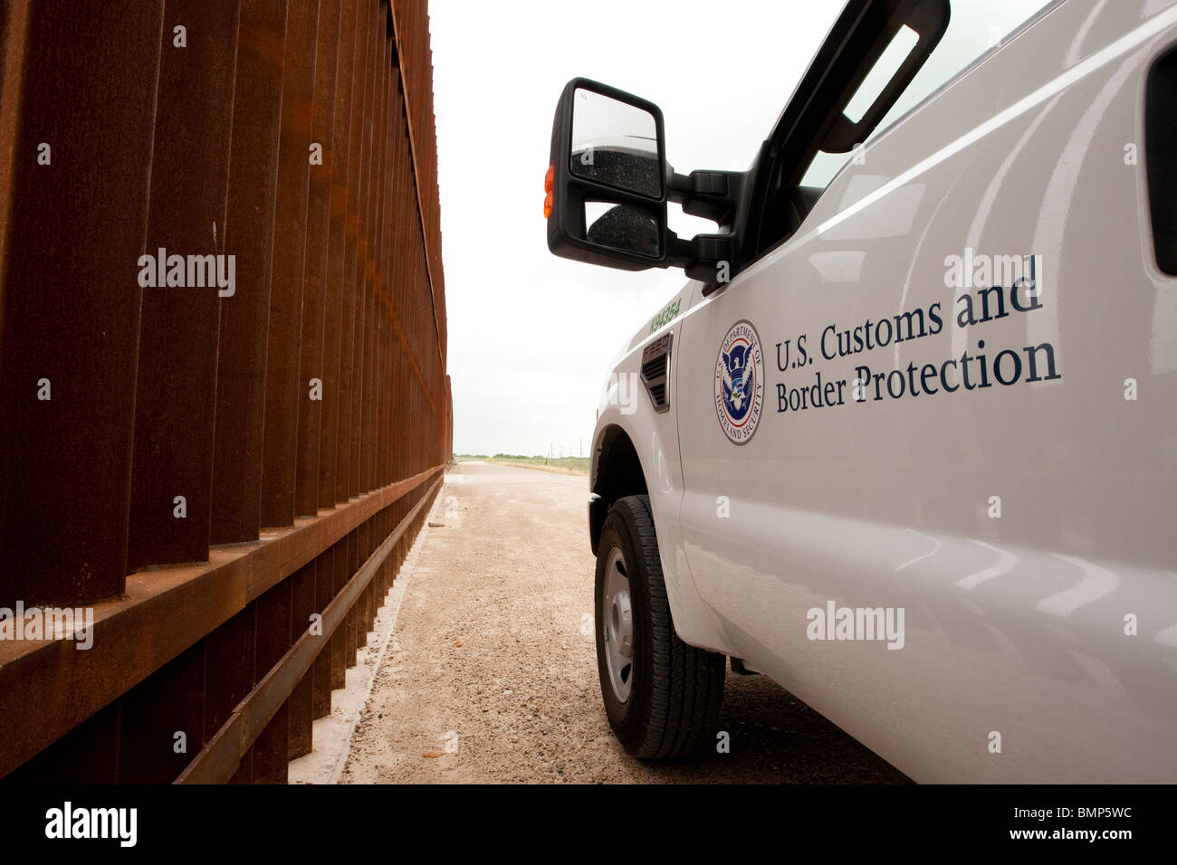 U.S. Border Patrol vehicle along the border wall between the United ...