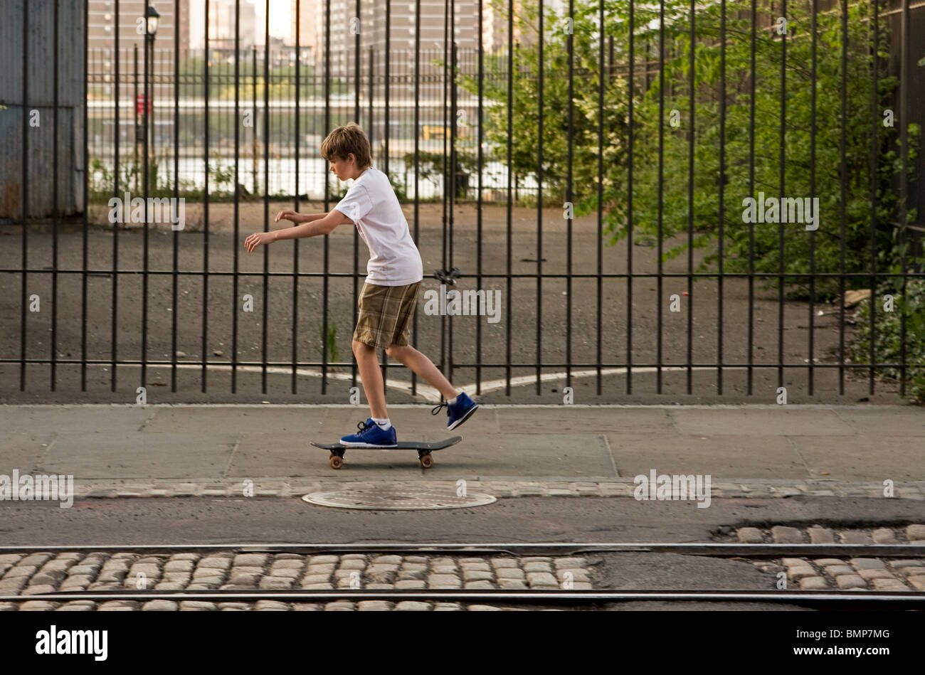 A boy with blue shoes enjoys skateboarding in Brooklyn Stock Photo - Alamy