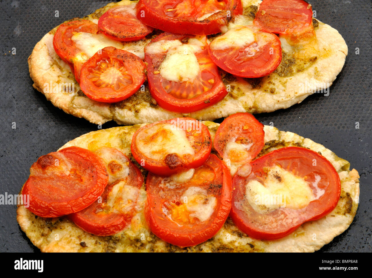 Pita bread with tomato and melted cow Mozzarella cheese toppings Stock ...