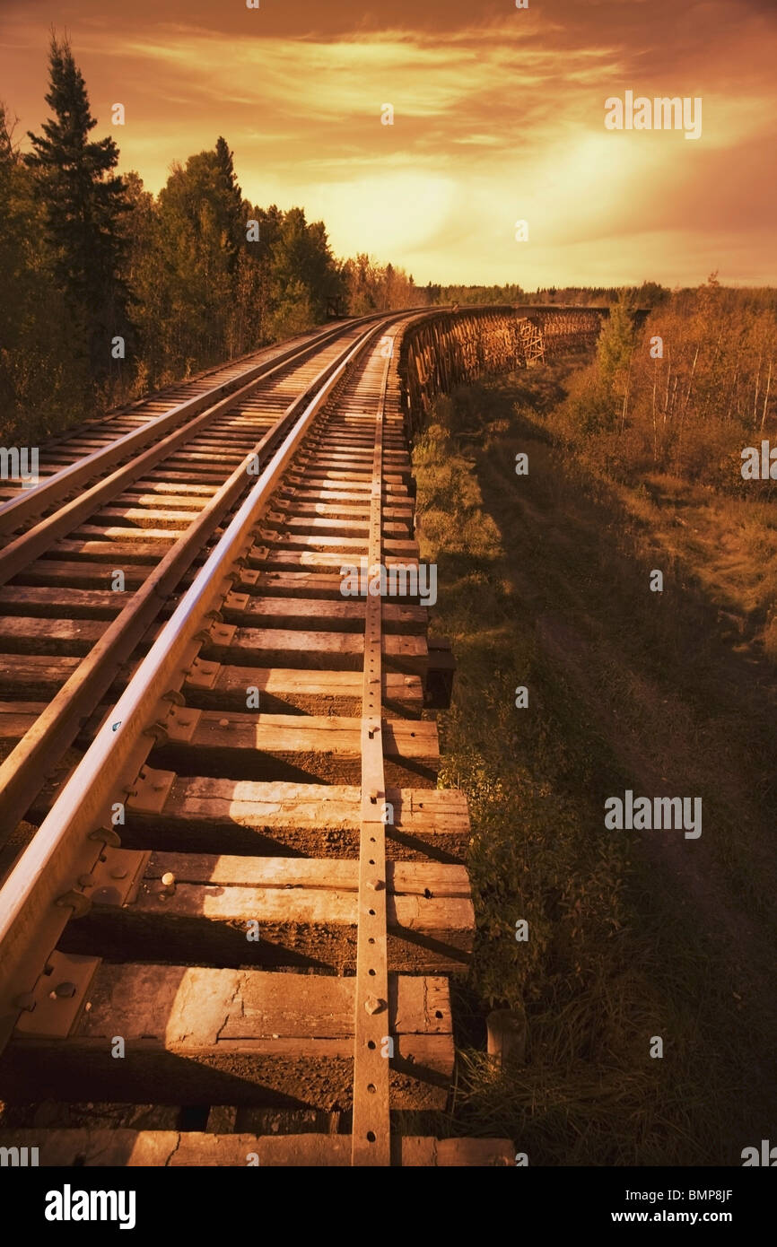 Alberta, Canada; Train Trestle At Sunset Stock Photo - Alamy