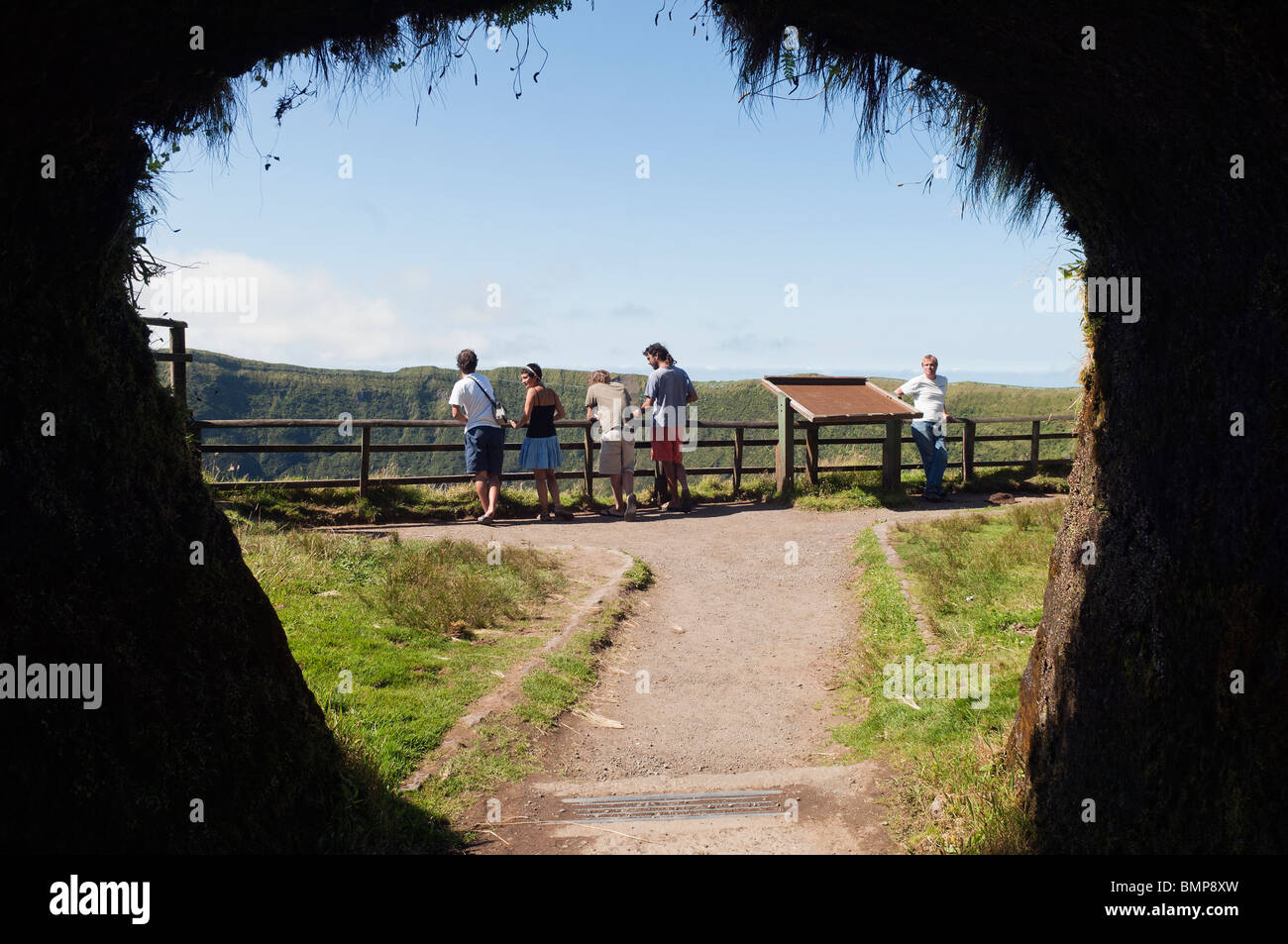 Tourists admiring Caldeira extinct volcano in Faial island, Azores ...