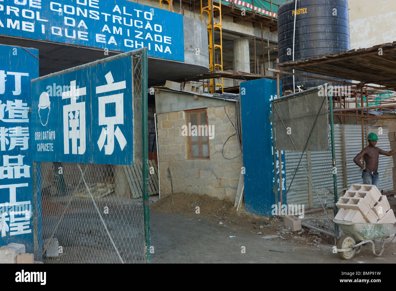 African worker on a chinese construction site in Maputo, Mozambique ...