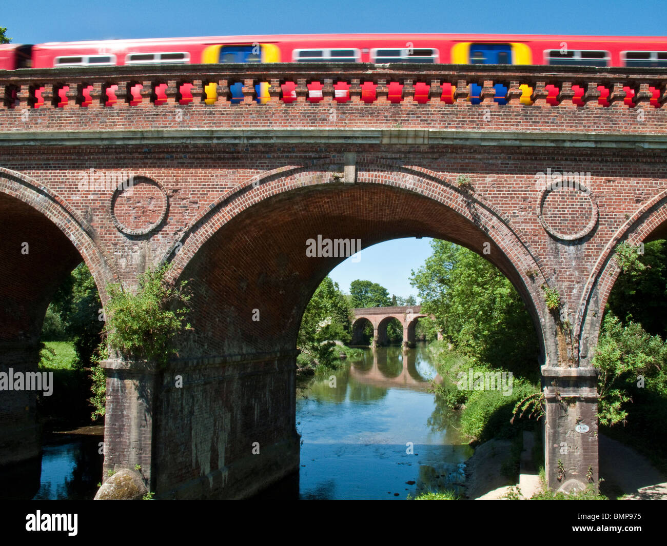 Train crossing over rail bridge over River Mole. Leatherhead, Surrey ...