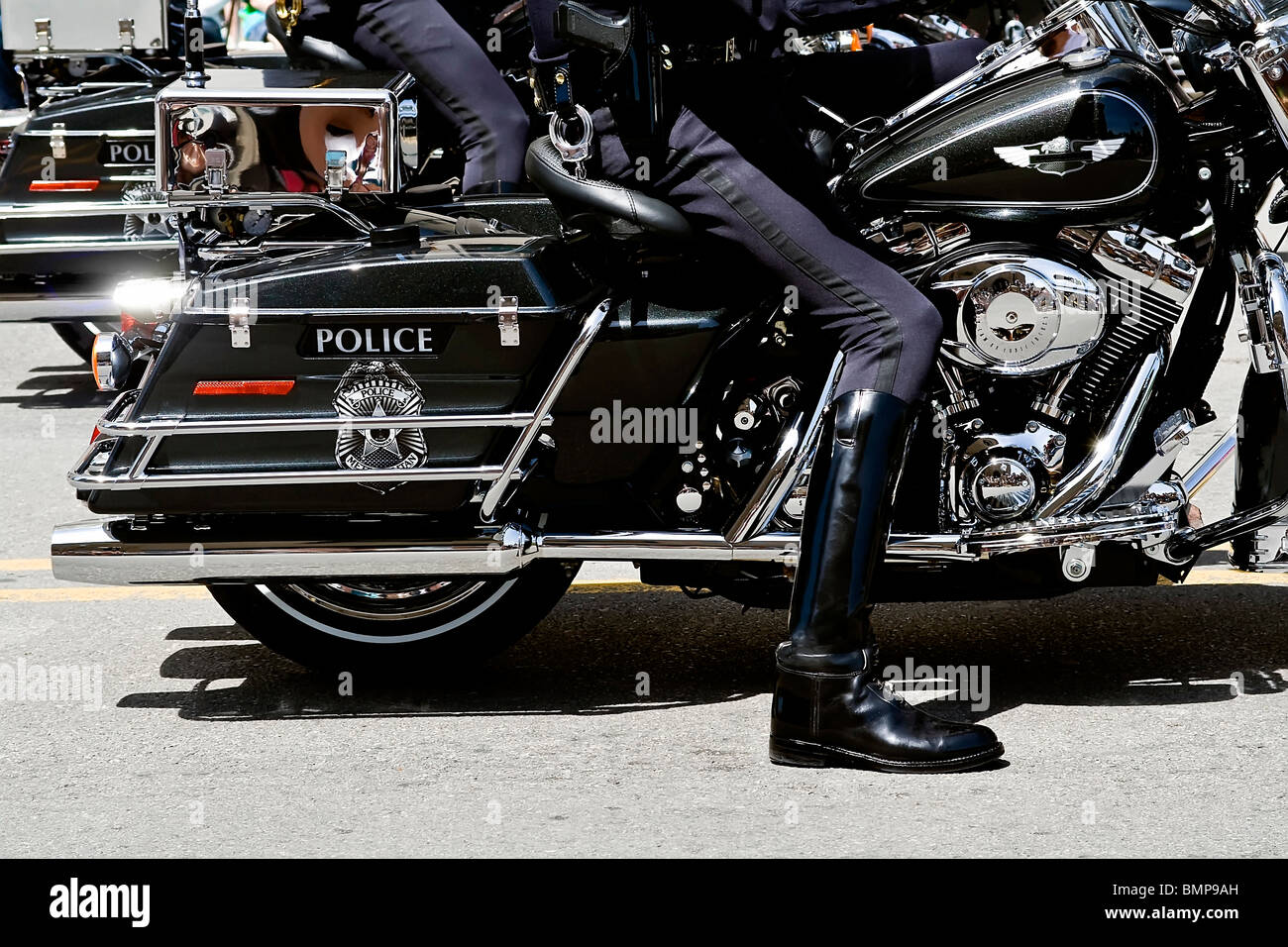 Close up of a police officer’s legs on a motorcycle Stock Photo - Alamy