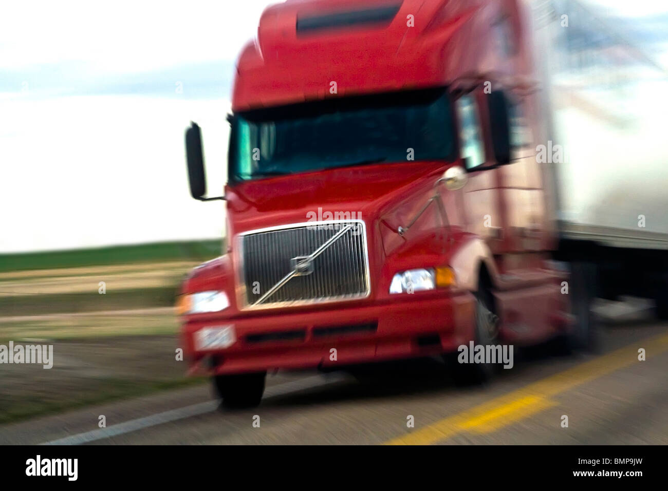 Oncoming semi-truck trailer on two-lane highway Stock Photo - Alamy