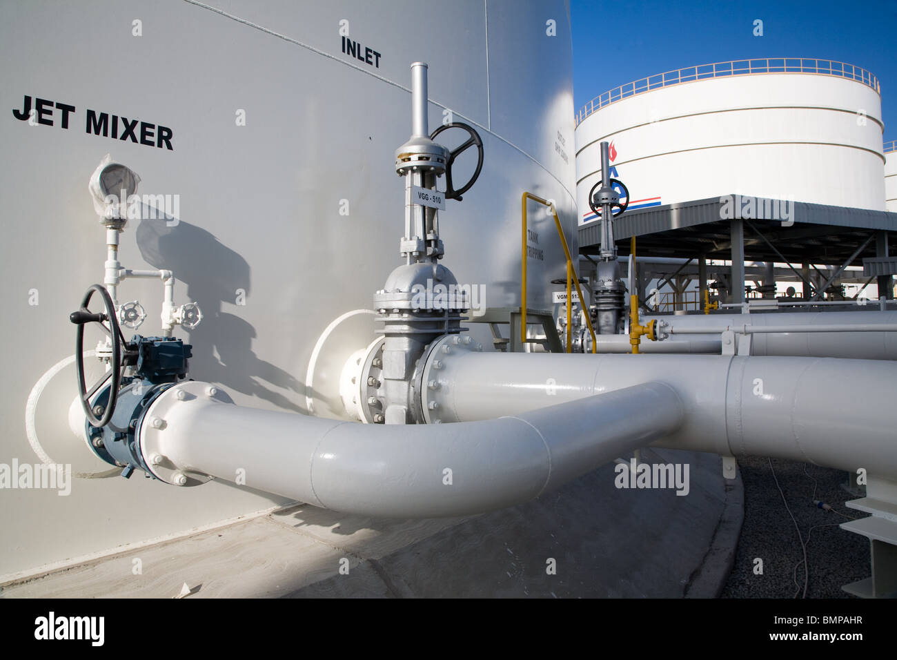 petrochemical oil storage tank farm tanks pipes Stock Photo - Alamy