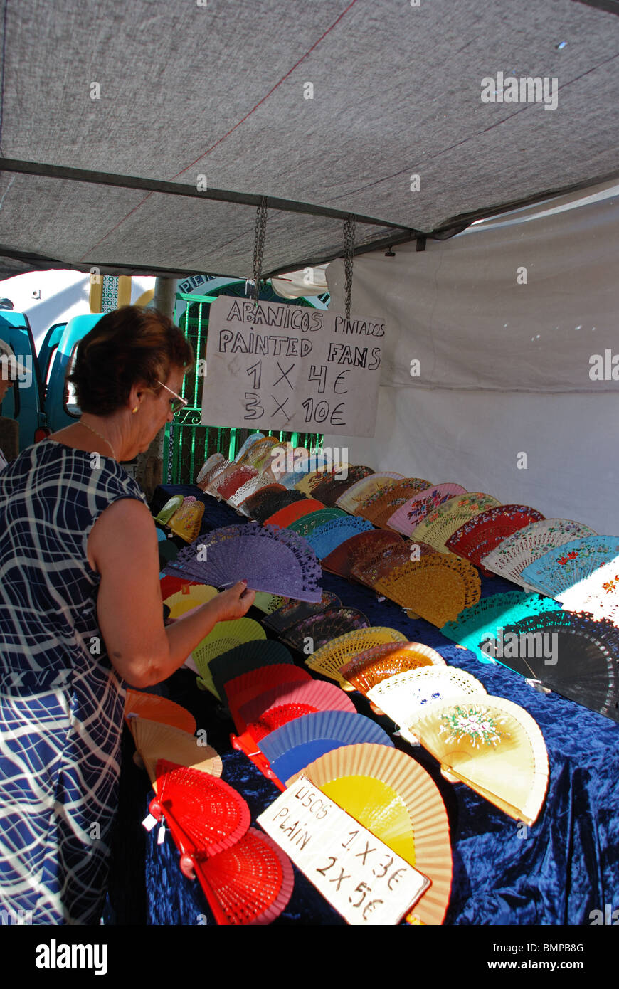 Stall selling fans at the outdoor market, Fuengirola, Costa del Sol ...