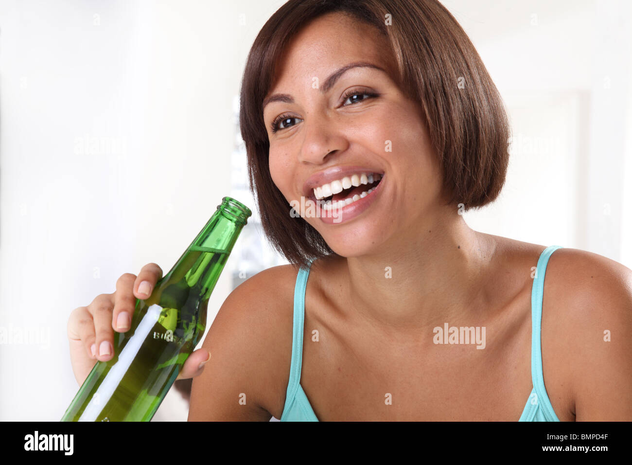 WOMAN DRINKING BEER FROM BOTTLE Stock Photo - Alamy