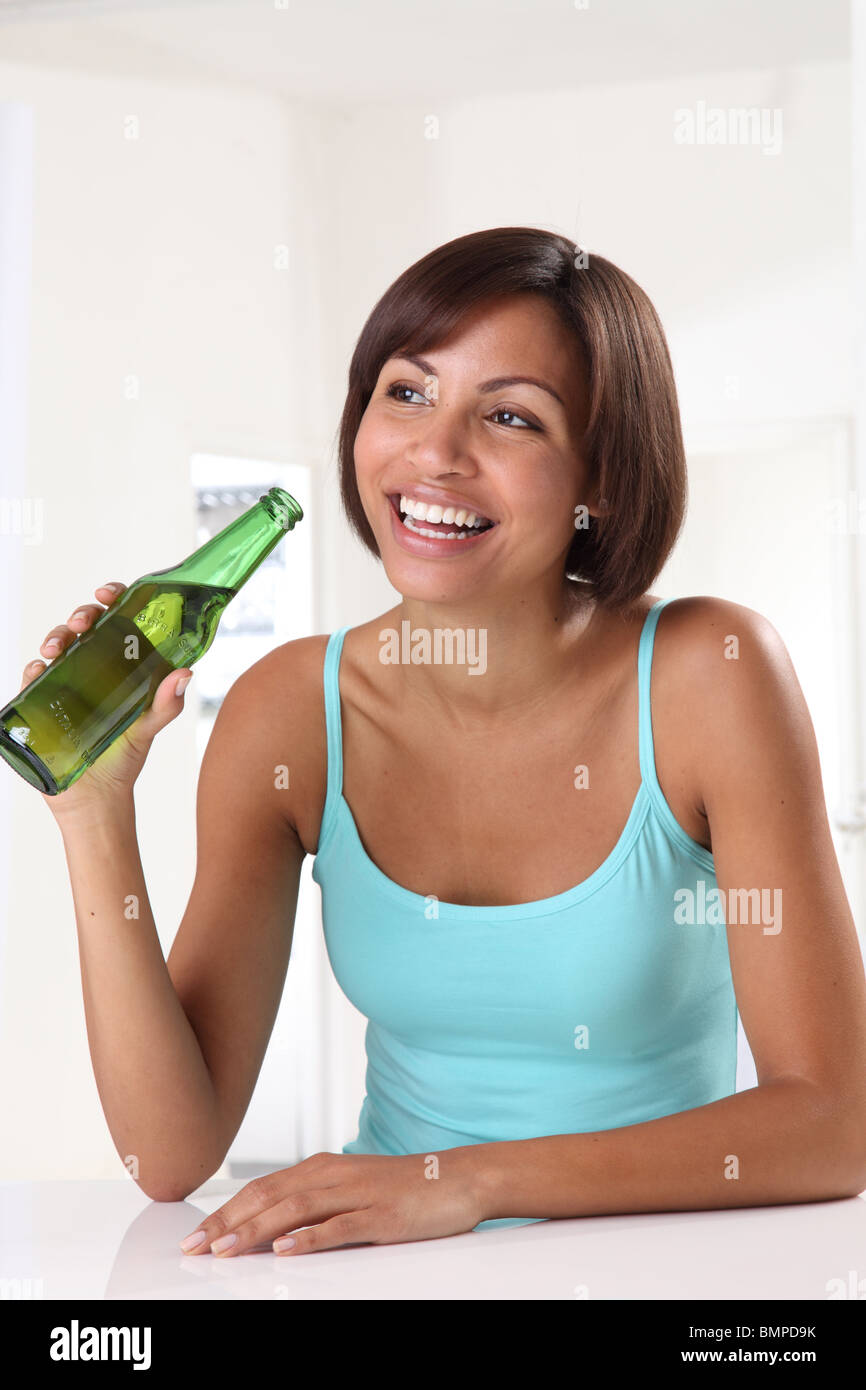 WOMAN DRINKING BEER FROM BOTTLE Stock Photo - Alamy