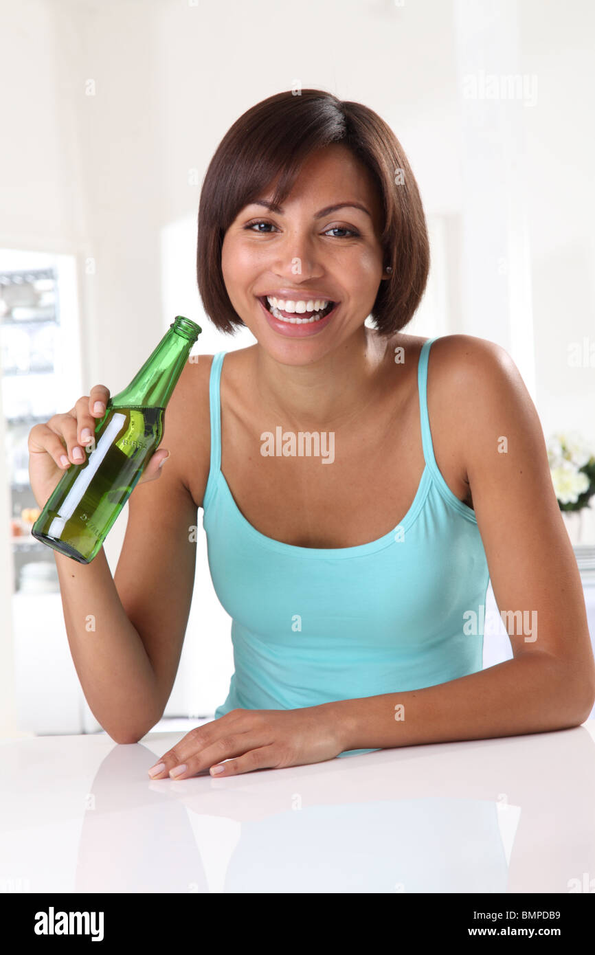 WOMAN DRINKING BEER FROM BOTTLE Stock Photo - Alamy