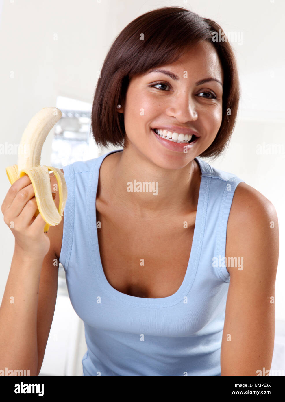 WOMAN EATING A BANANA Stock Photo - Alamy