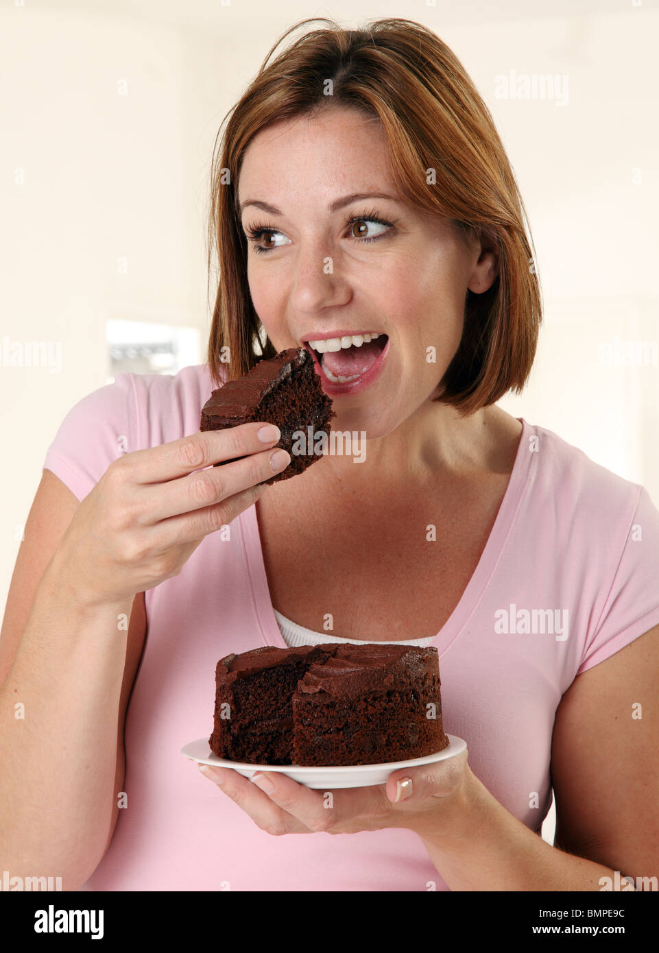 WOMAN EATING CHOCOLATE CAKE Stock Photo - Alamy