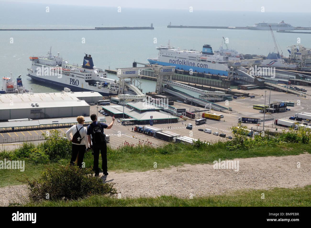 Tourists on coastal path above the cross channel port of Dover Kent ...