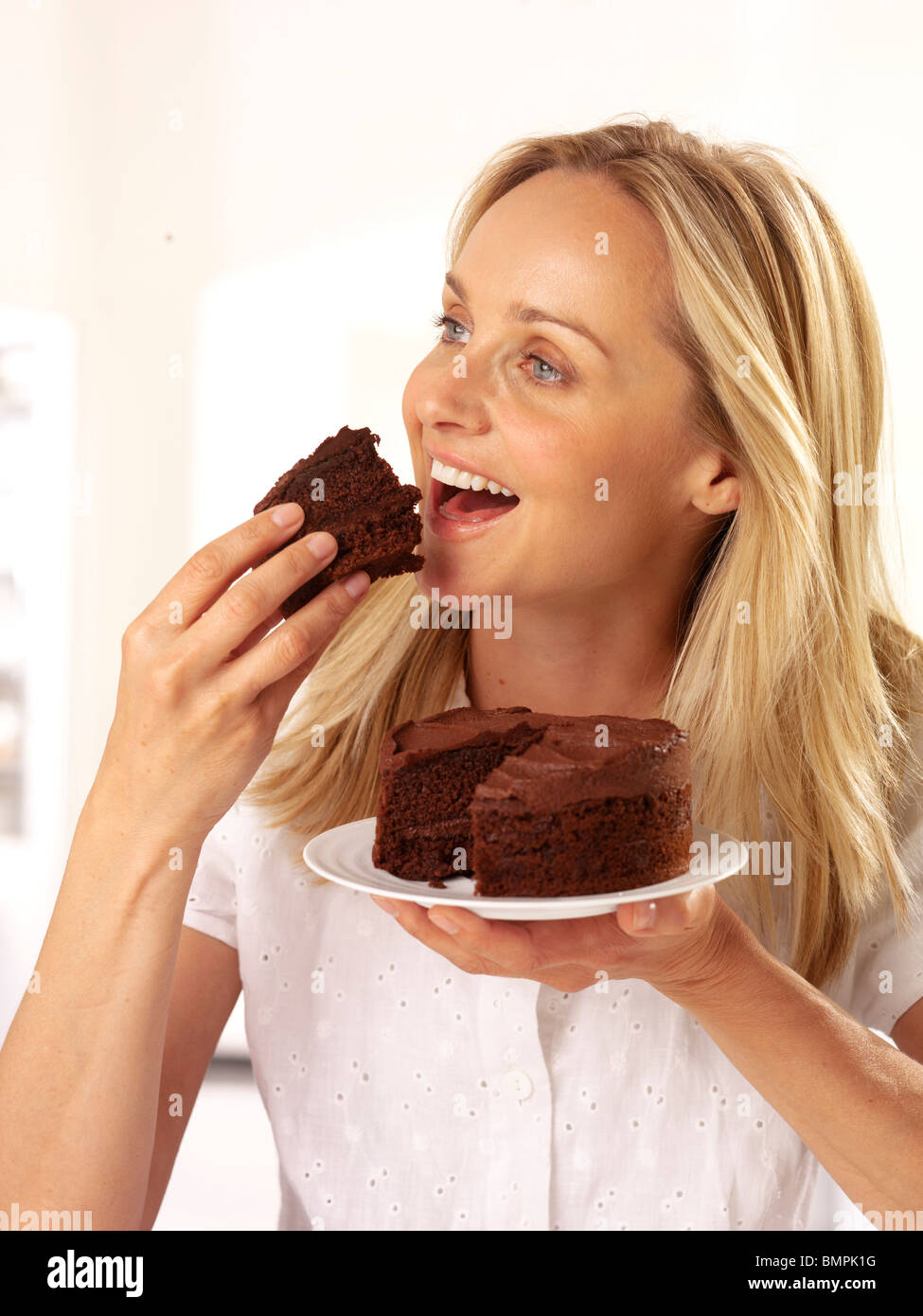 Fat woman eating slice cake hi-res stock photography and images - Alamy