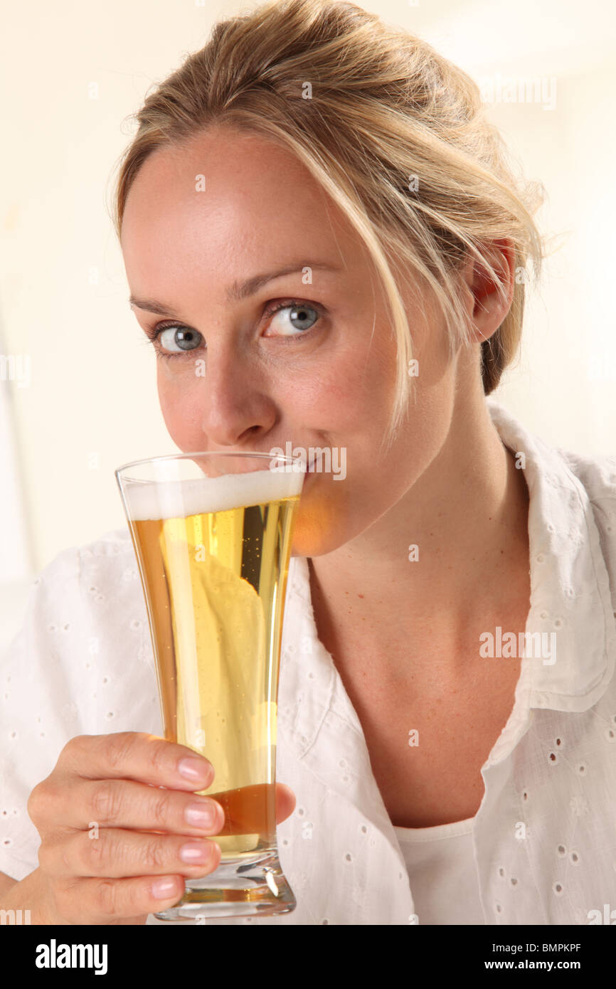 WOMAN DRINKING BEER Stock Photo - Alamy