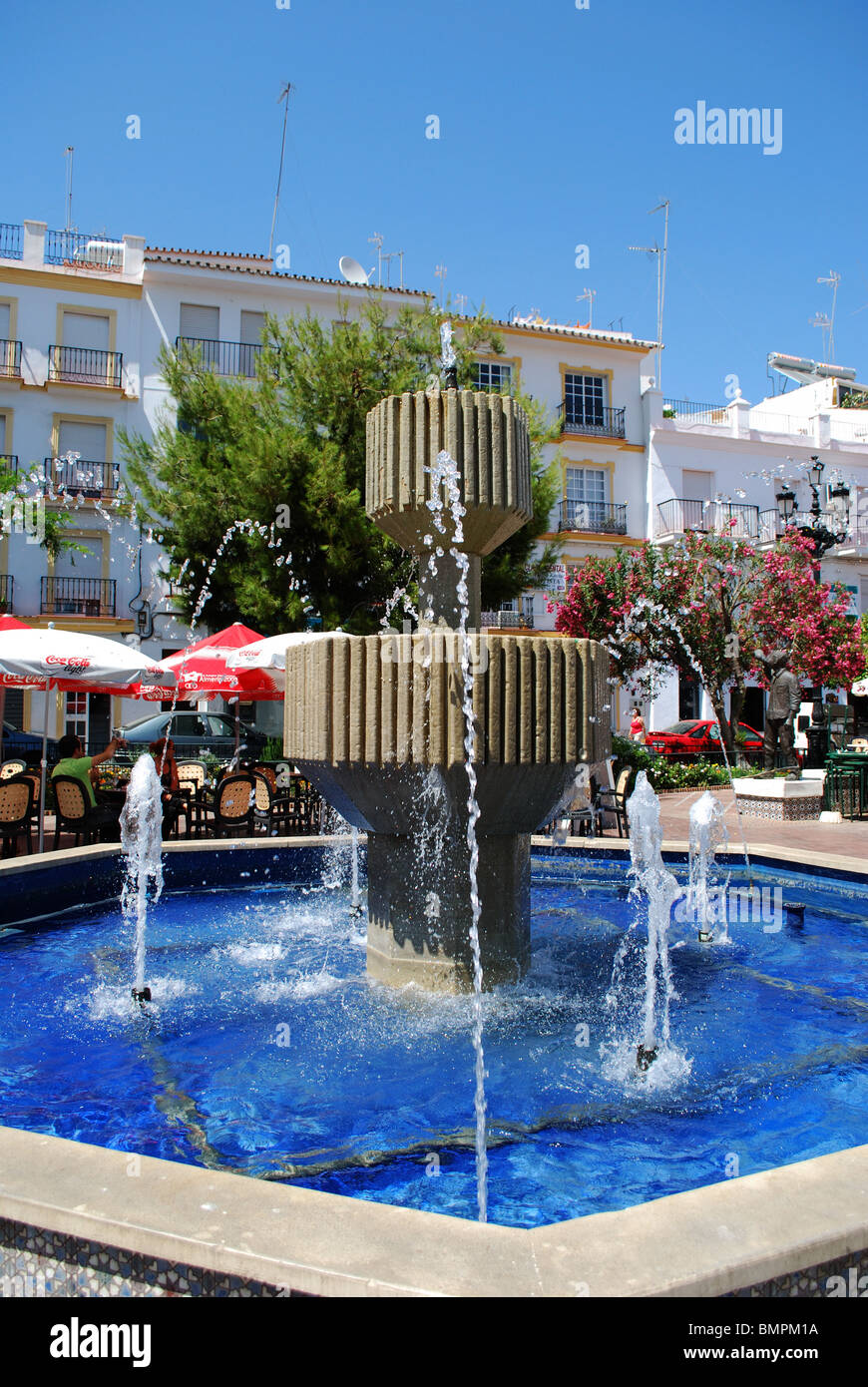 Fountain in the town square, whitewashed village (pueblo blanco ...