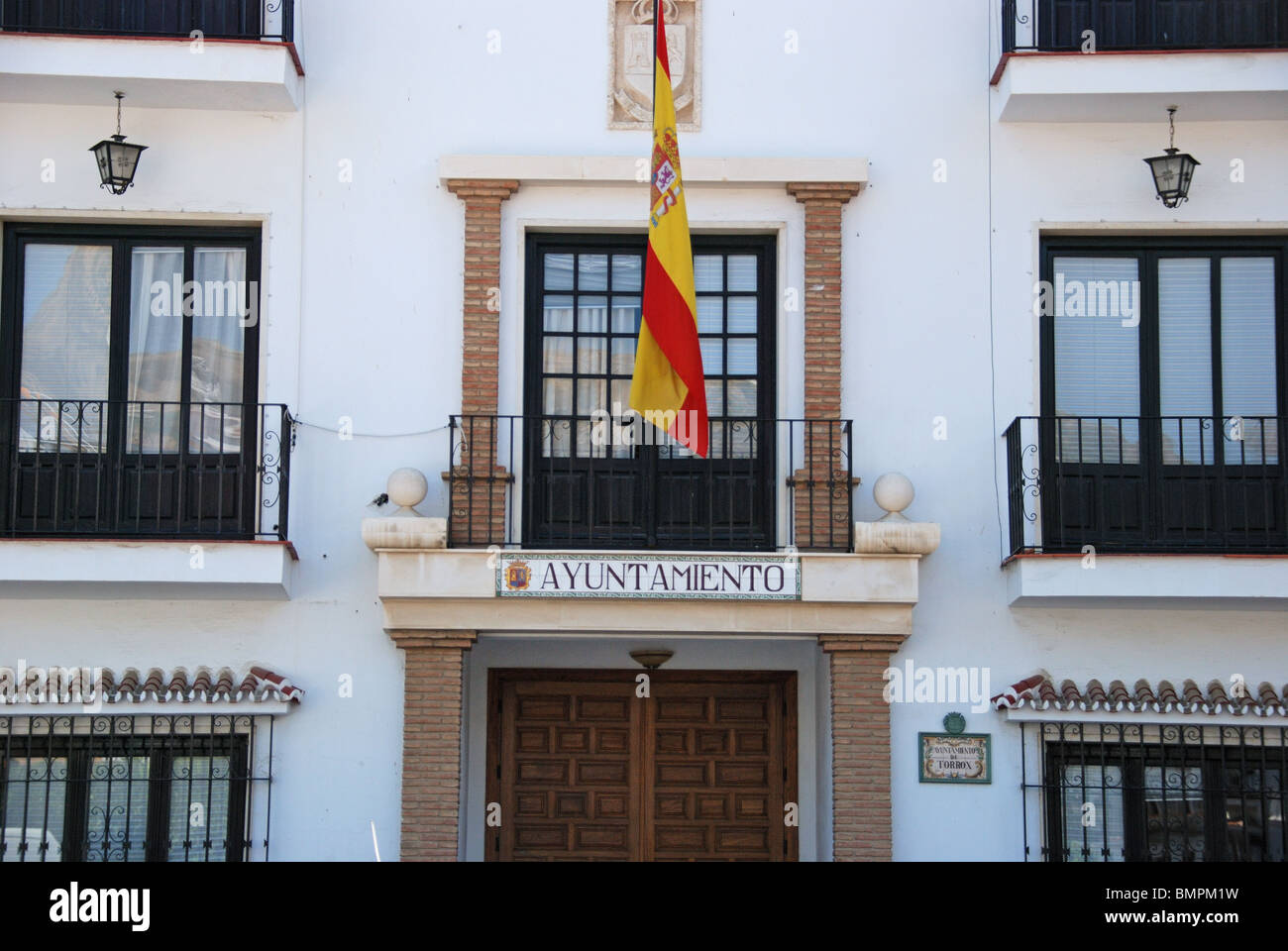 The town hall (ayuntamiento), whitewashed village (pueblo blanco ...