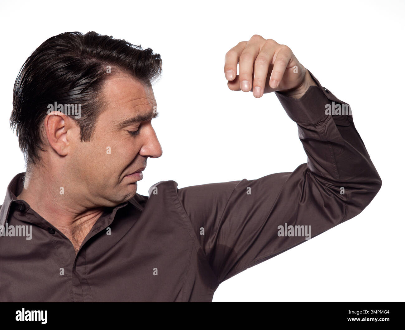 one caucasian man looking at sweat stain sweating perspiring stain ...